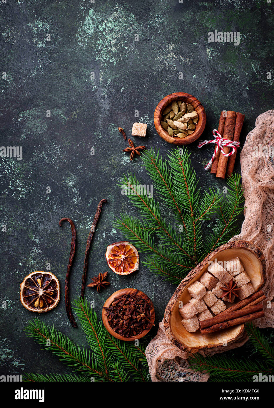 Traditional Christmas spices on green background Stock Photo - Alamy