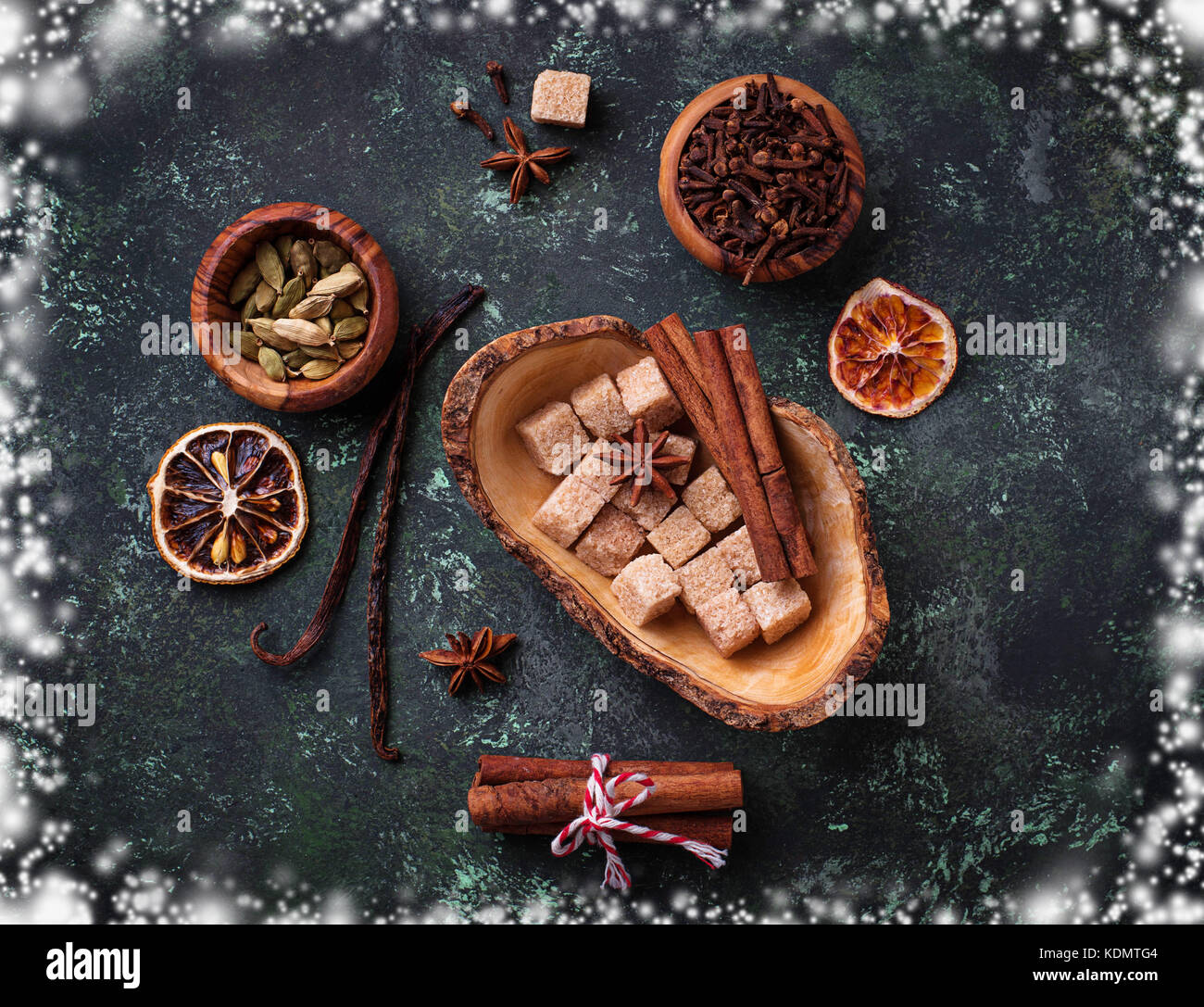 Traditional Christmas spices on green background Stock Photo - Alamy