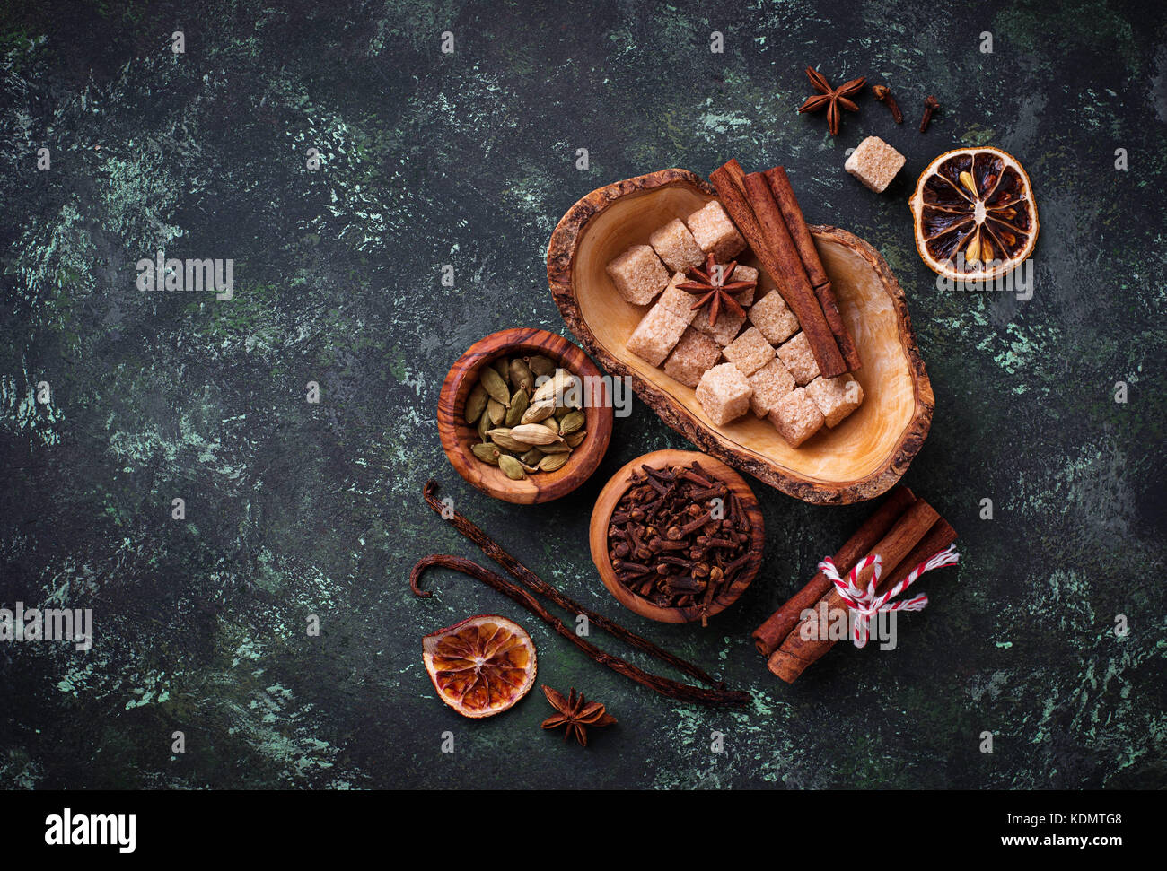 Traditional Christmas spices on green background Stock Photo - Alamy