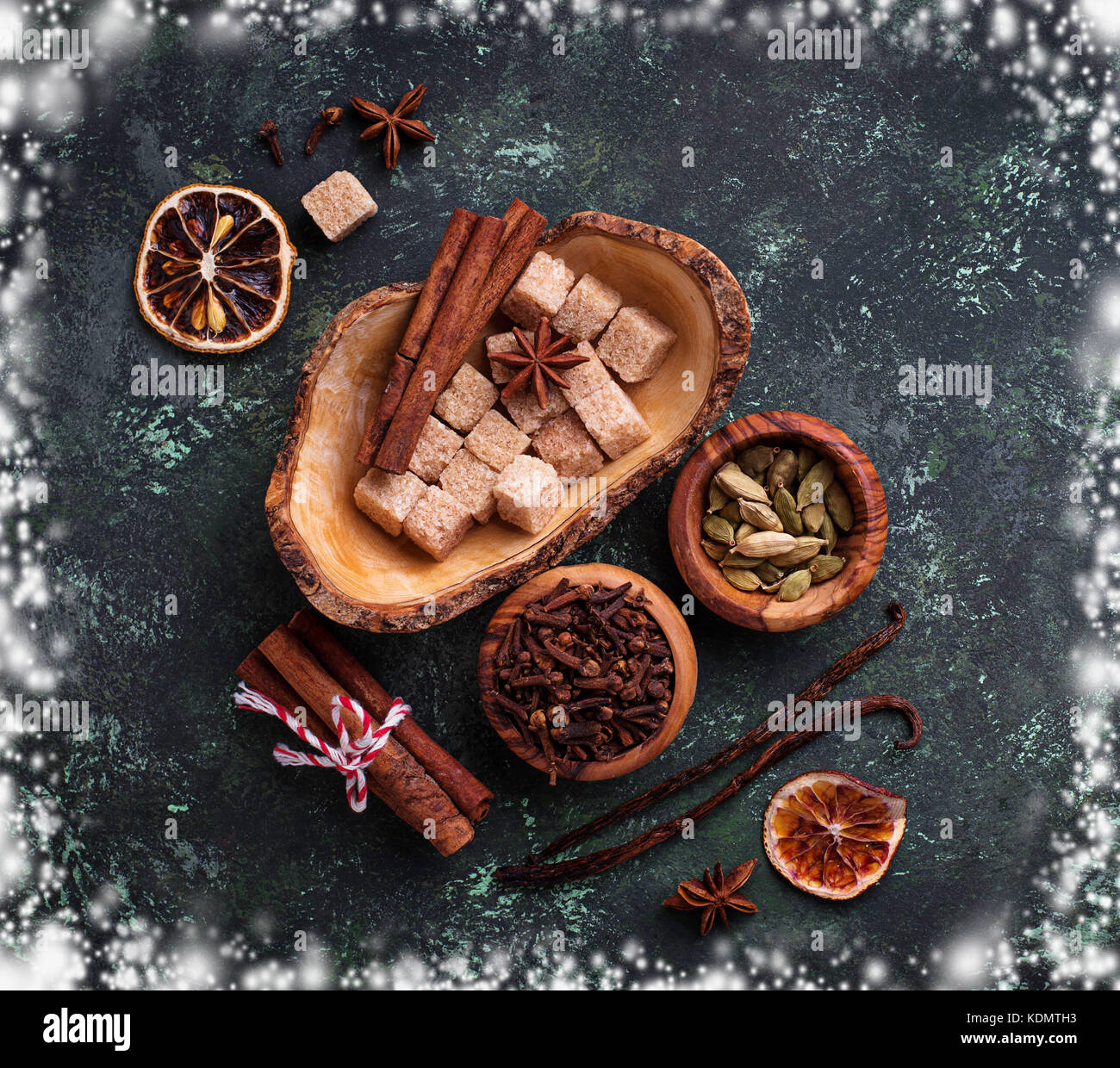 Traditional Christmas spices on green background Stock Photo - Alamy