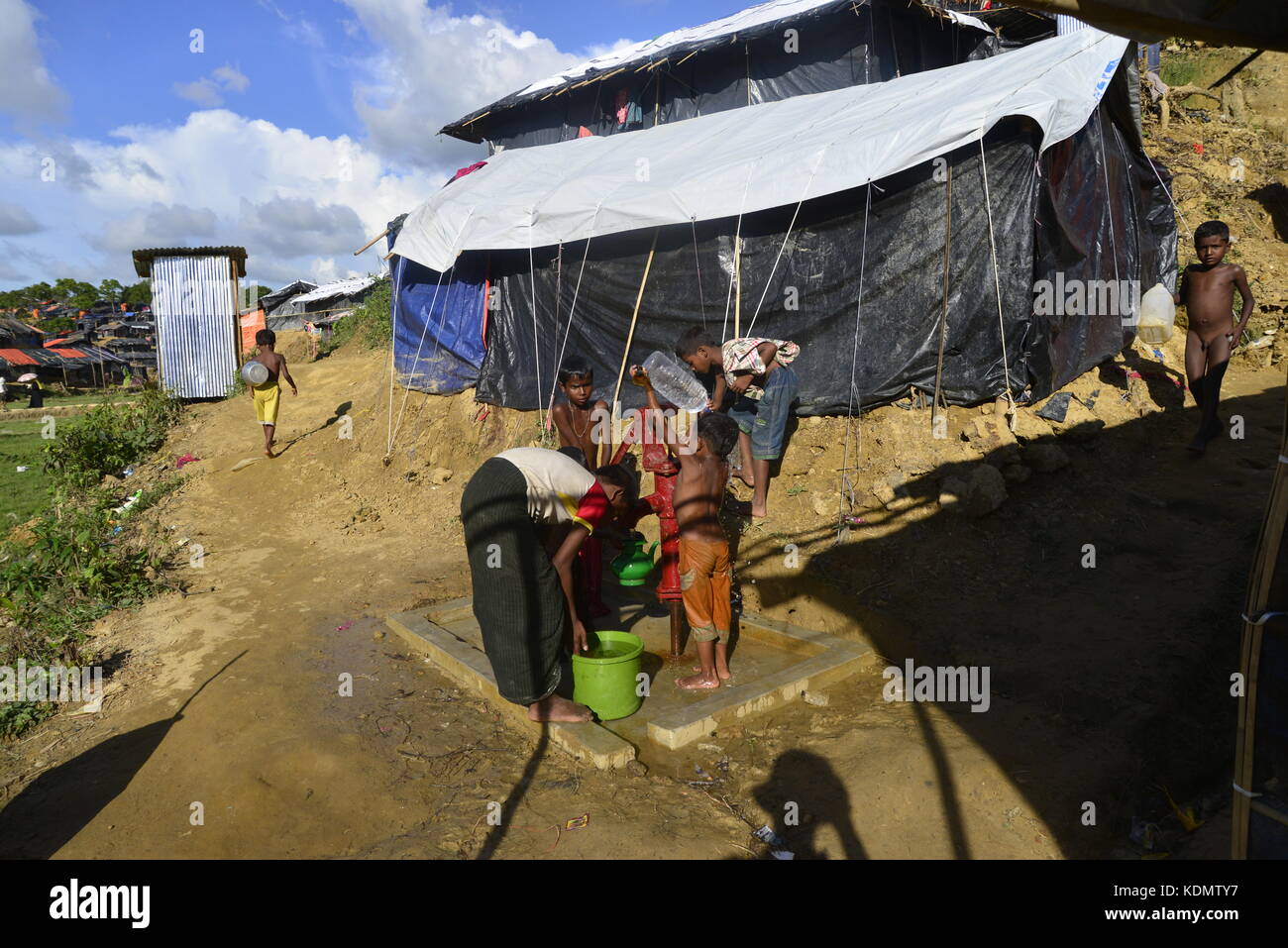 Rohingya refugees collect drinking from tube-well at the Balukhali ...