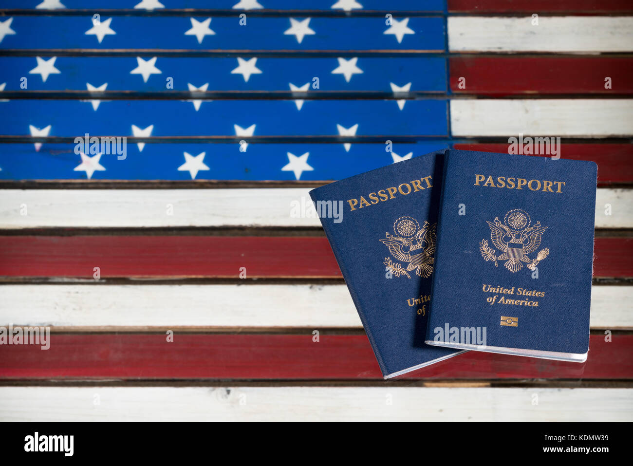 USA passports on glass table over US Flag Stock Photo - Alamy