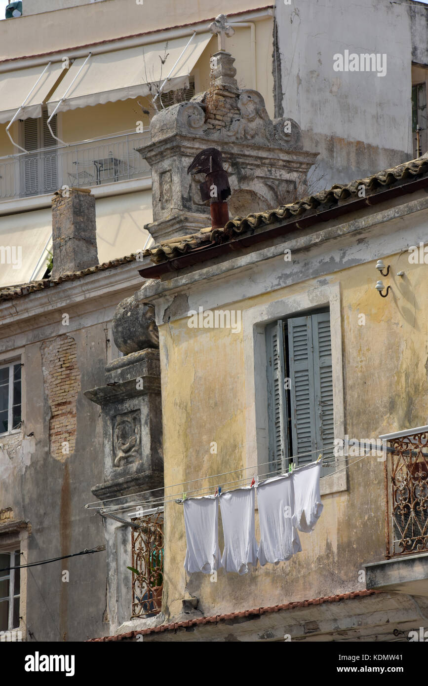 some washing or laundry hanging on a line in a greek backstreet to dry ...