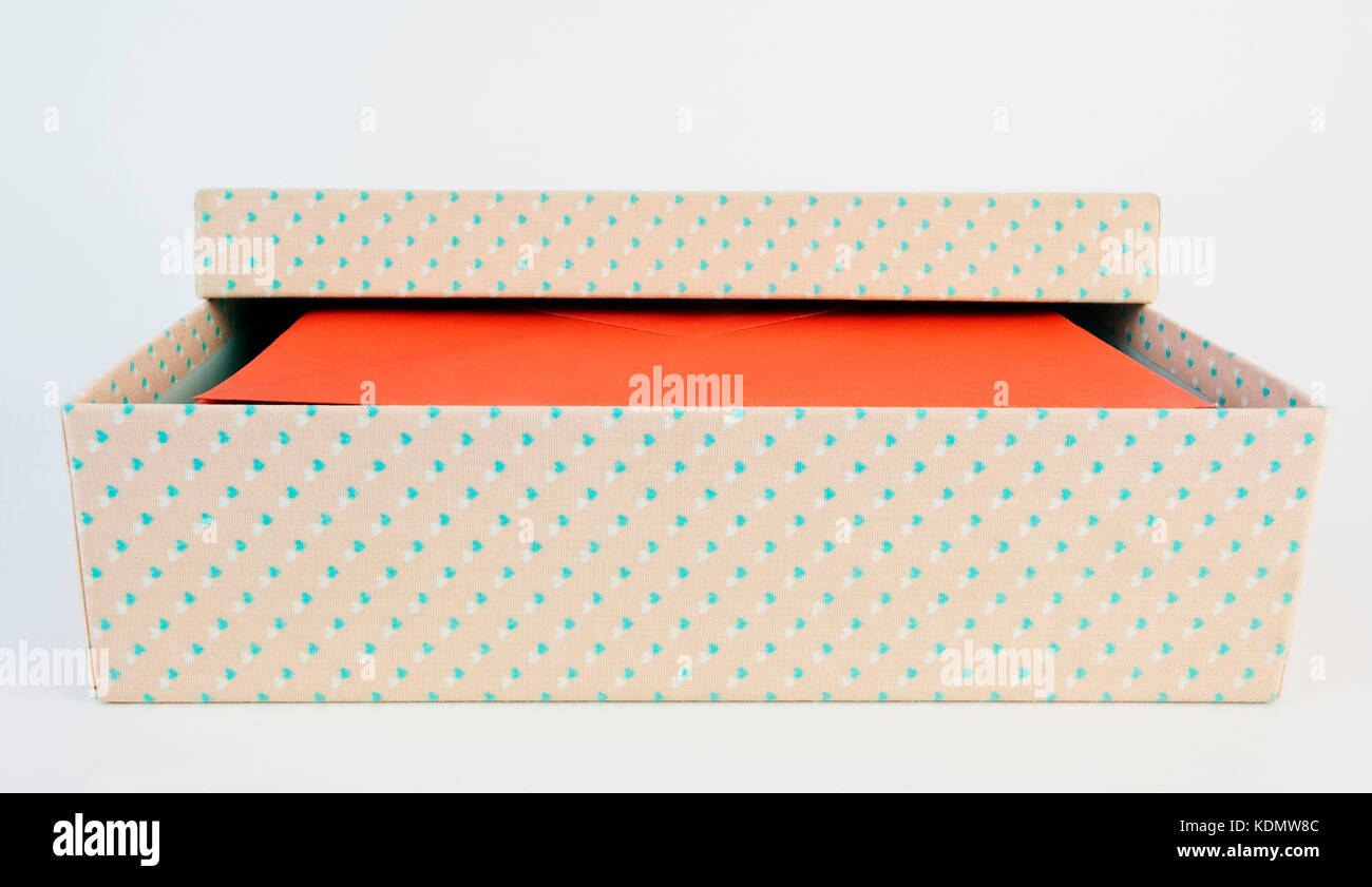 Simple open fabric covered box with "something" orange inside Stock ...