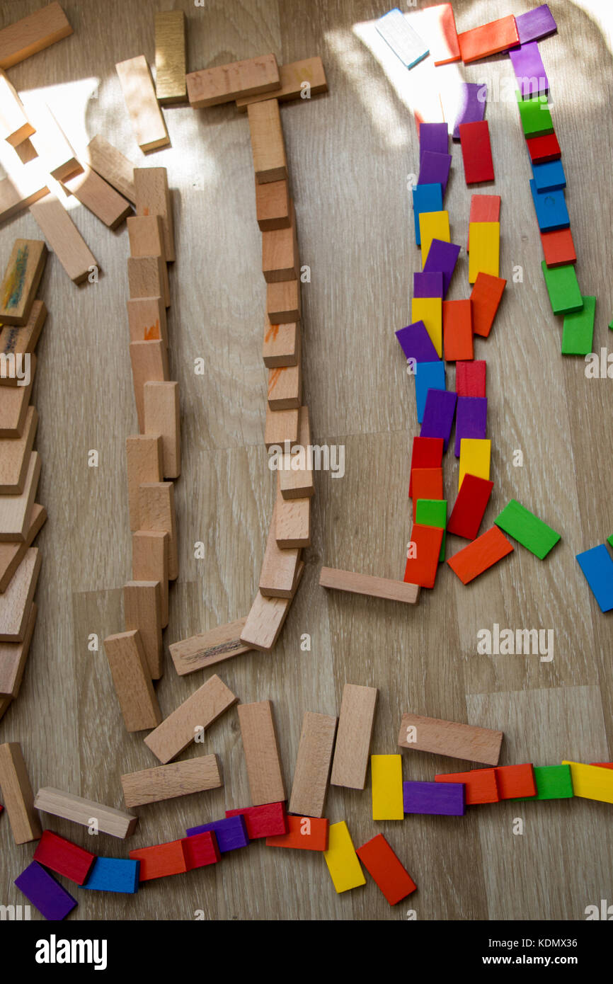 Colorful Domino Blocks in a line on a white background Stock Photo - Alamy