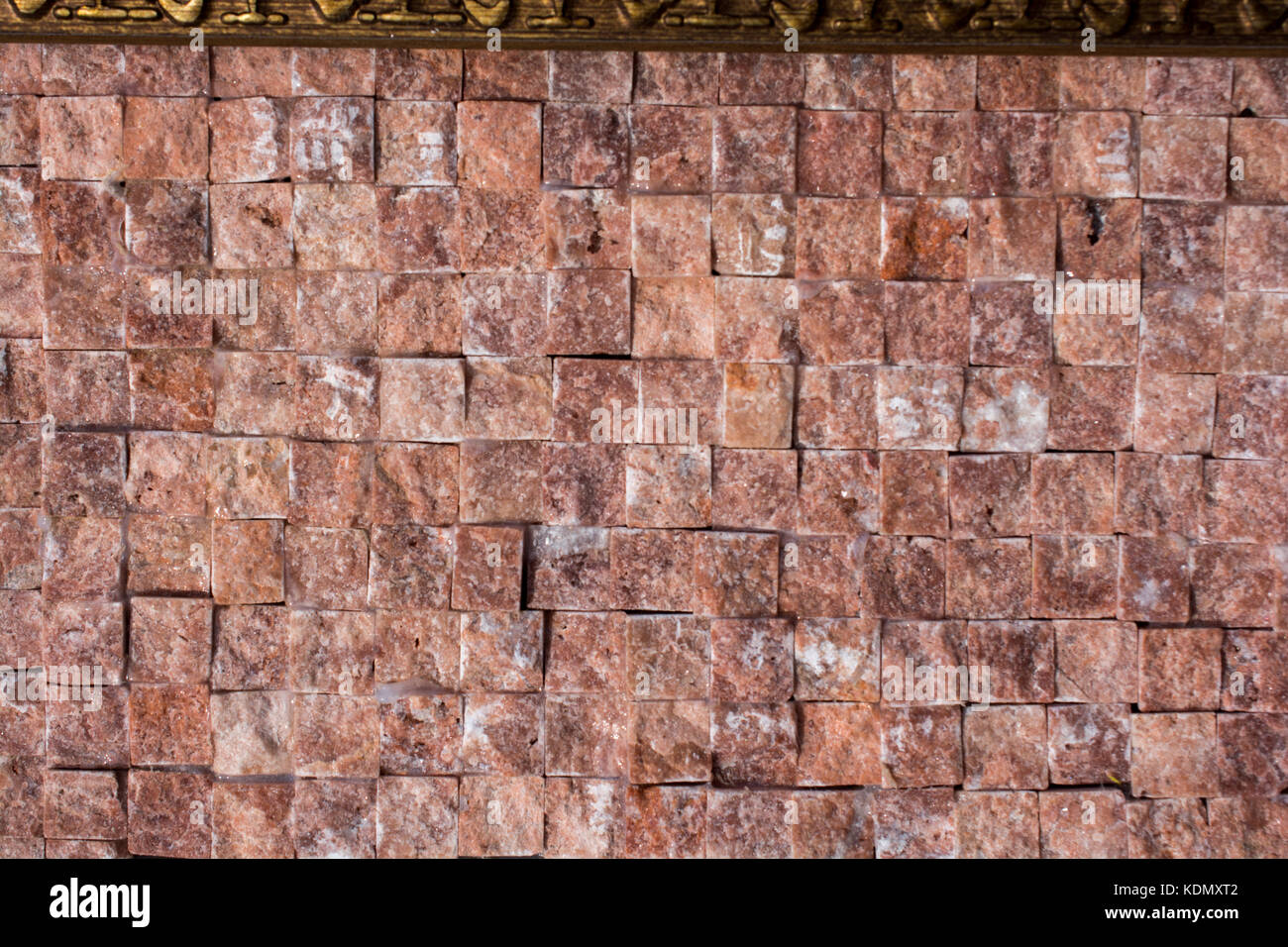 Decorative cubic stone wall as background texture Stock Photo - Alamy