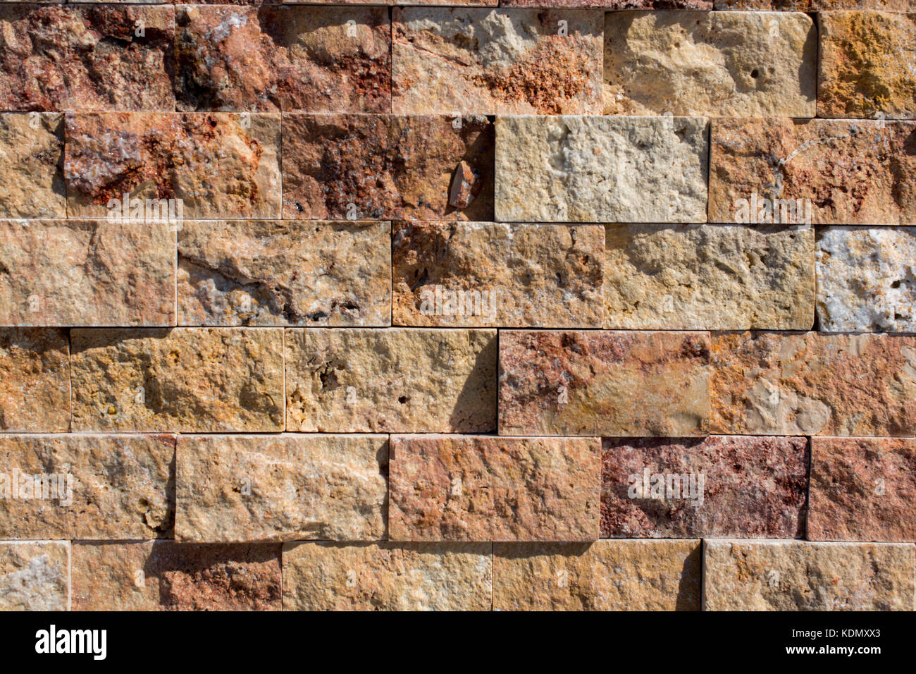 Decorative cubic stone wall as background texture Stock Photo - Alamy