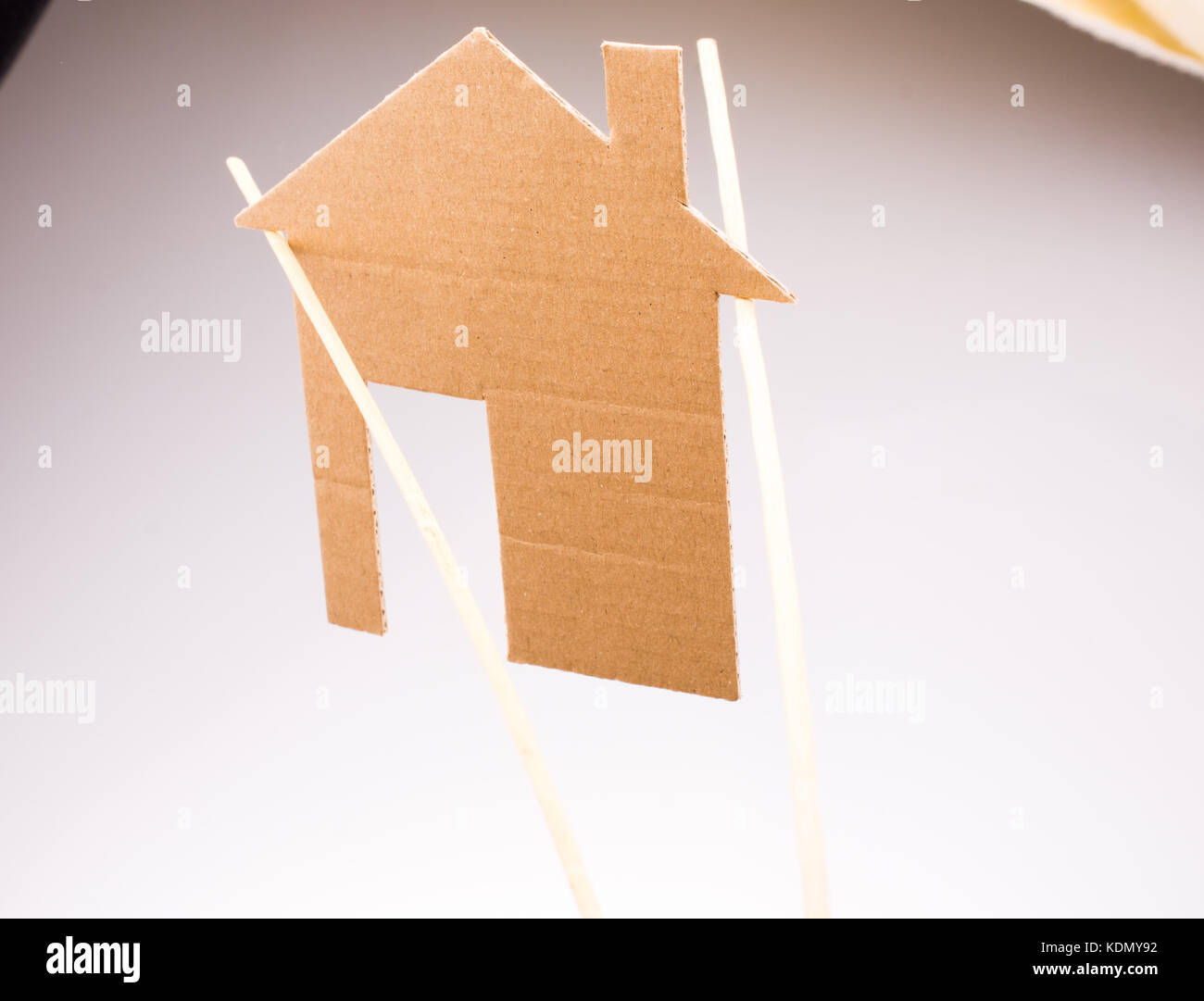 Little house shape cut out of paper on a canvas background Stock Photo ...