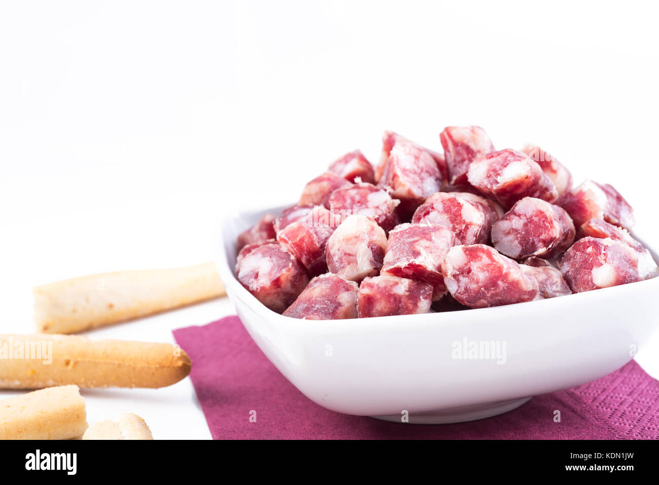 sliced of italian dried salami and breadstick as appetizer Stock Photo ...