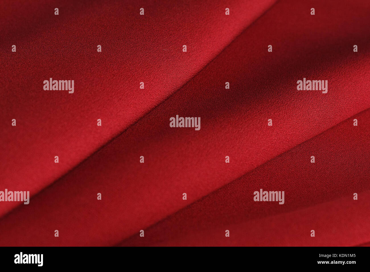 Folds of red knitted fabric close-up Stock Photo - Alamy