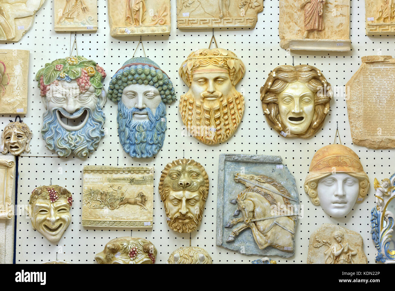 classical and mythical greek and roman masks for sale in a gift shop ...