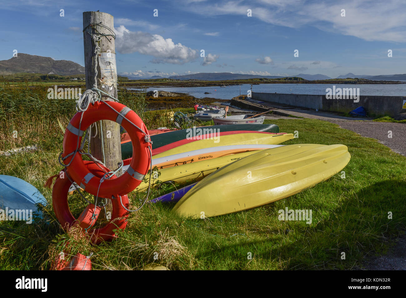 Kayaks at the old jetty at Kilchoan Scotland Stock Photo - Alamy