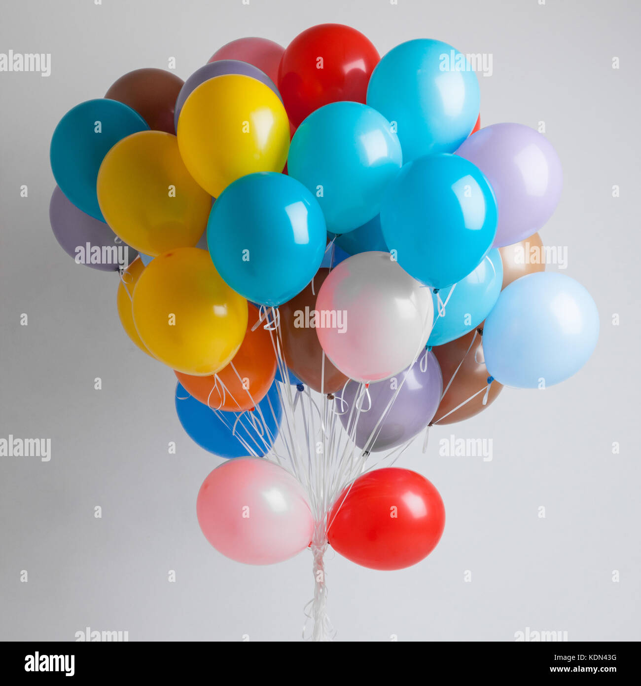 Many Colorful balloons on white background Stock Photo - Alamy