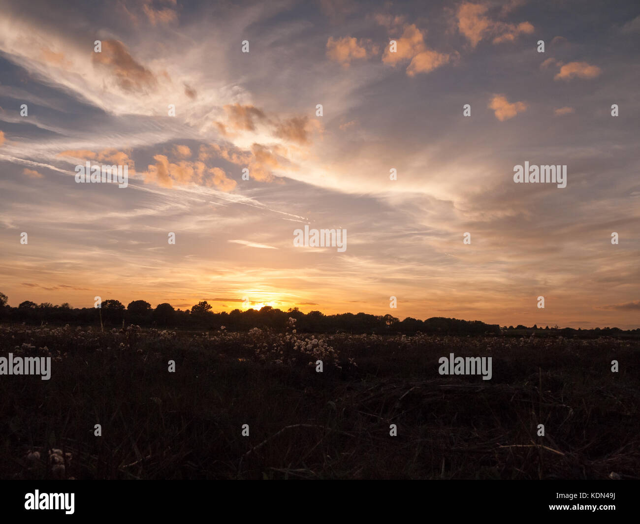 stunning bright autumn harvest sun set scene over lake water reflection ...