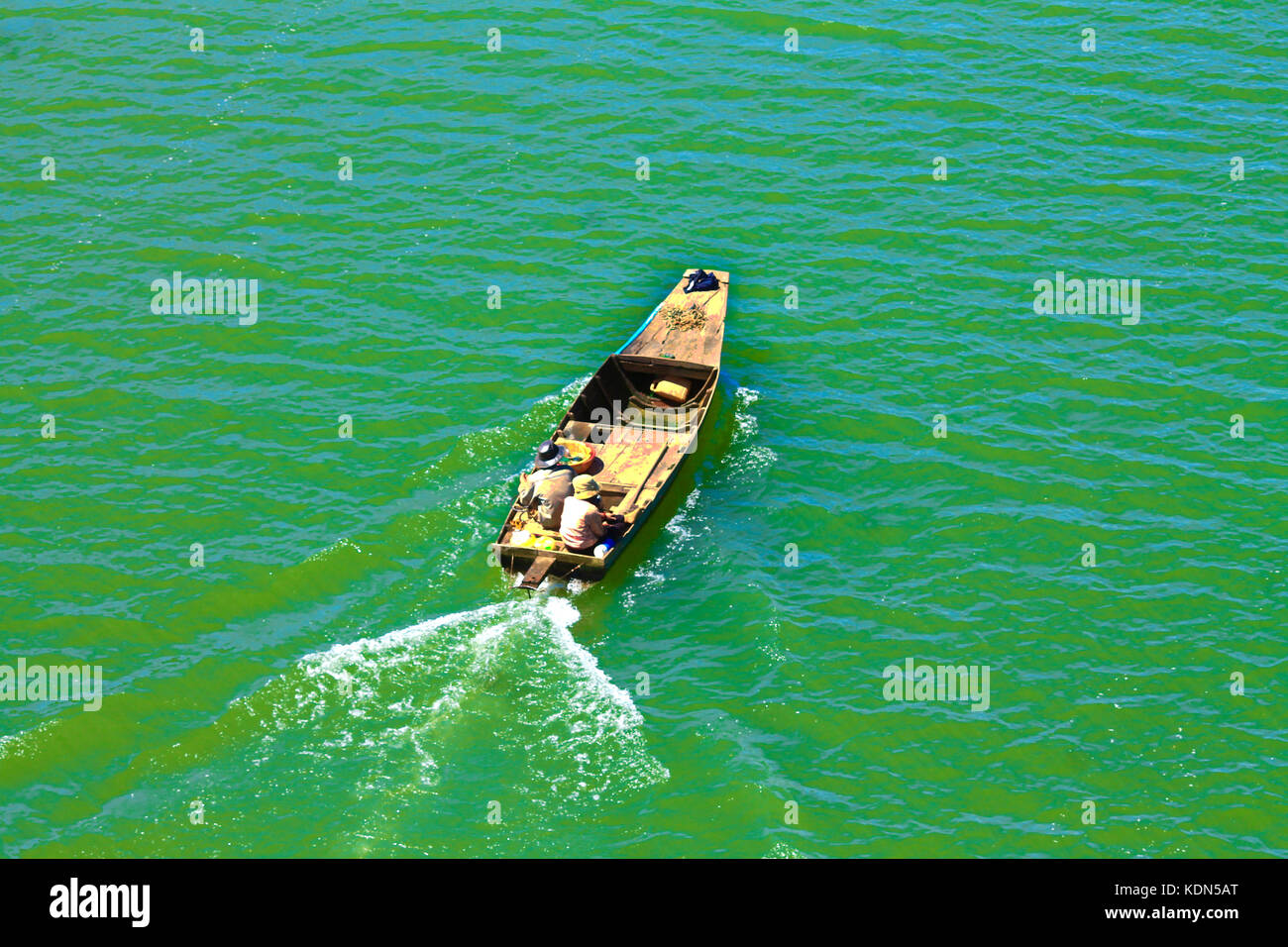 Aerial view of a traditional Vietnamese wooden boat cruising on the ...