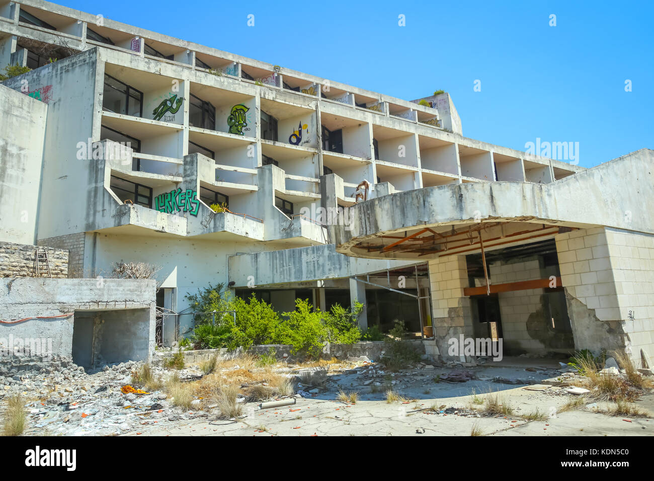 KUPARI, CROATIA - JULY 19, 2017 : The exterior of an old ruined hotel ...