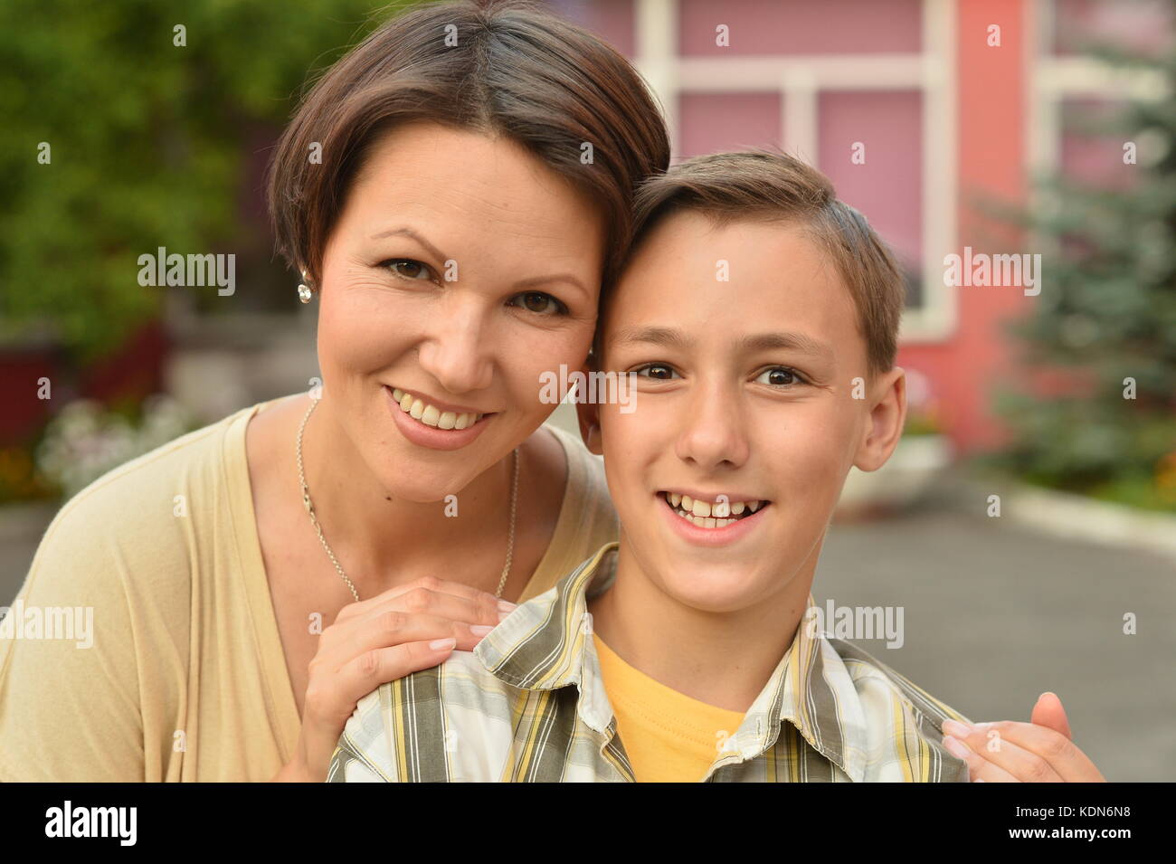 Mother hugging son sad hi-res stock photography and images - Alamy