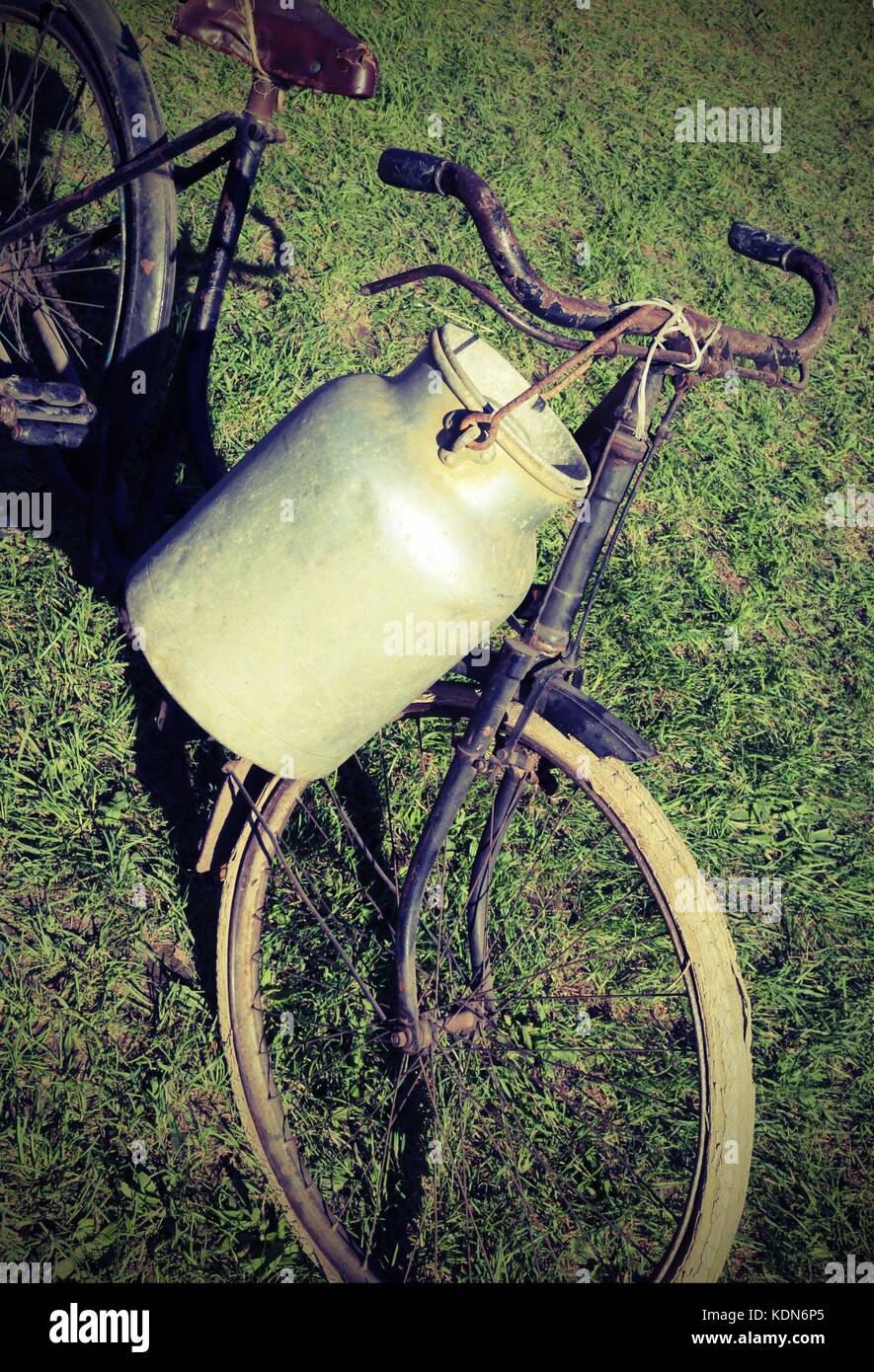 Ancient Bread Bicycle with Old Aluminum Milk Bin with lomo effect Stock ...