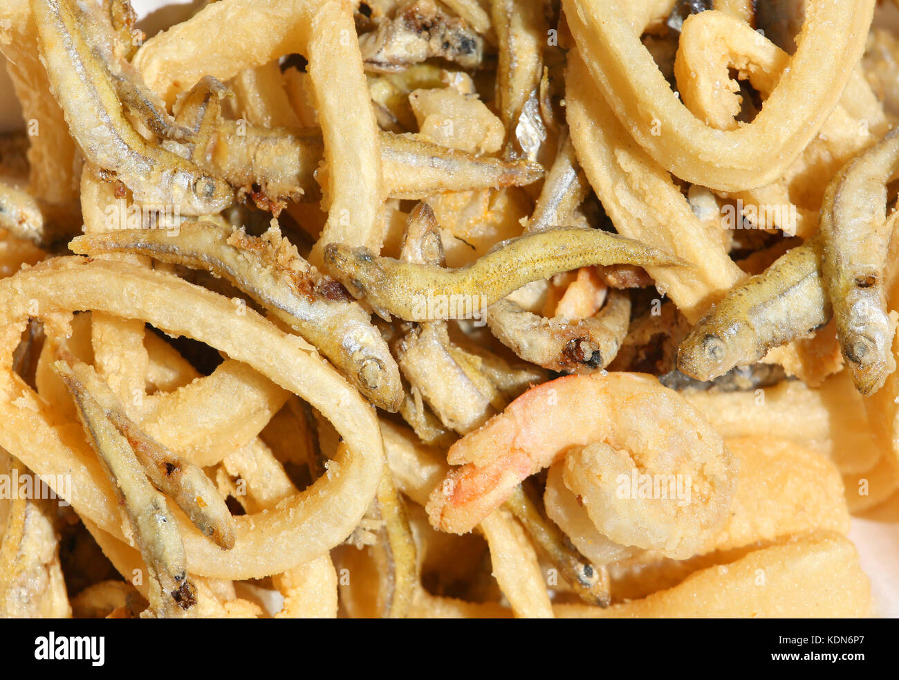 appetizing background of many fish fried with shrimp and squid Stock ...