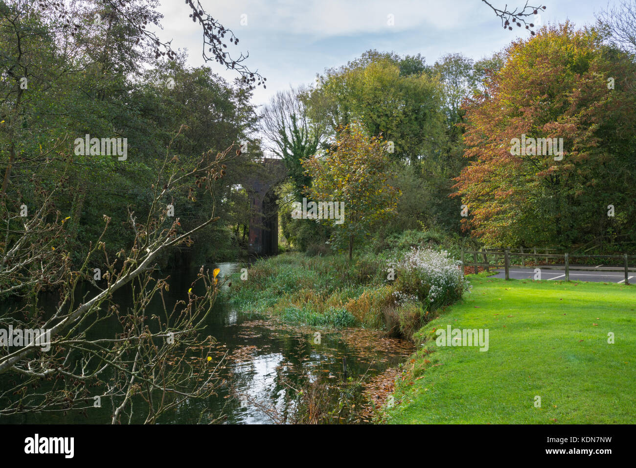 Railway bridge and the river Loddon in Old Basing village, Hampshire ...