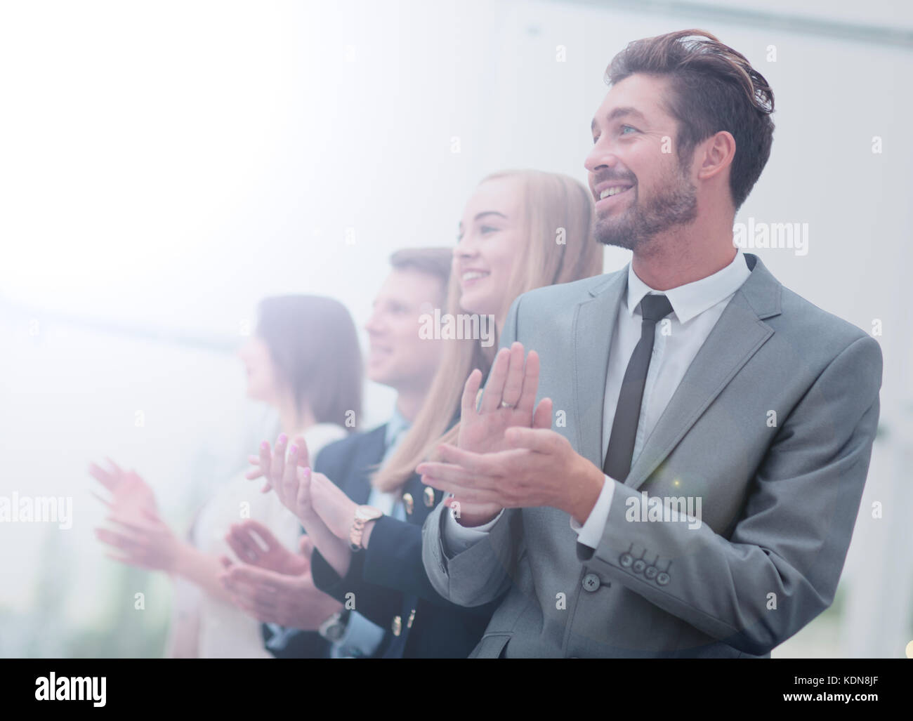 Business people standing in a row looking in same direction and Stock ...