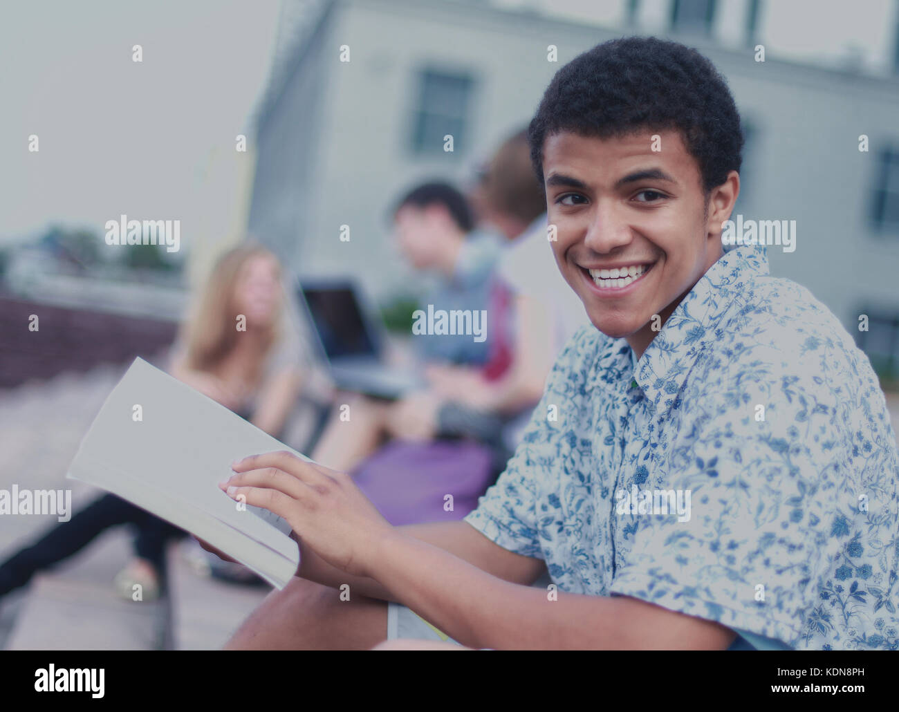 young boy sitting with friends Stock Photo - Alamy young boy sitting with friends Stock Photo - Alamy