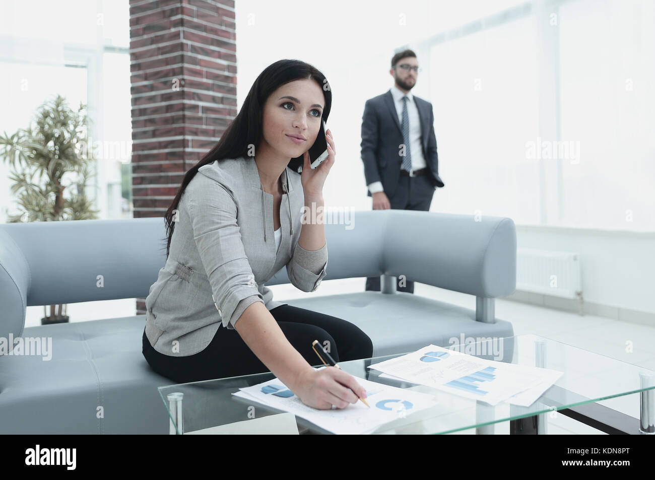 Woman assistant at the workplace in the office Stock Photo - Alamy