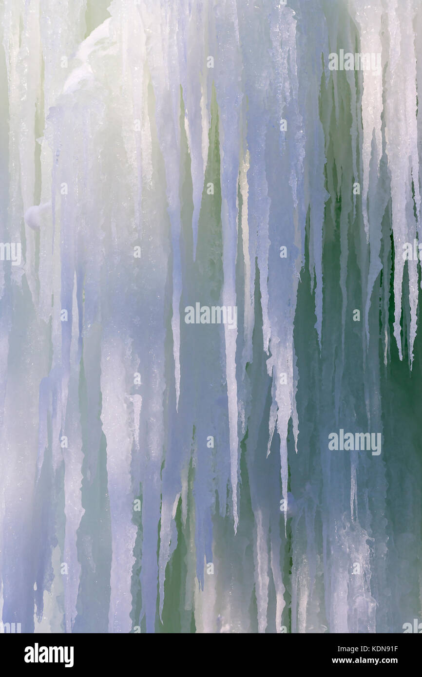 Background from a frozen waterfall of ice large icicles Stock Photo - Alamy