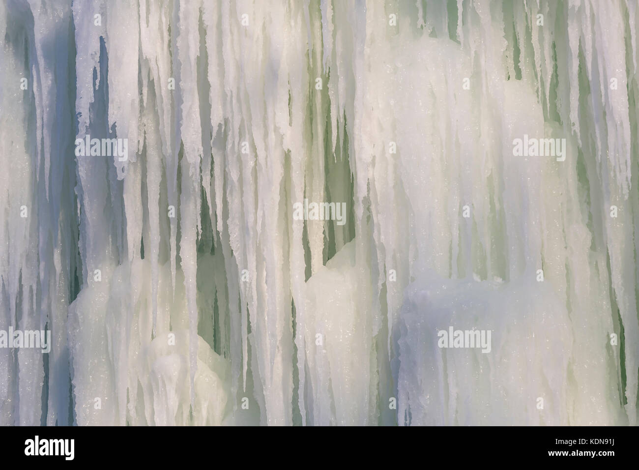 Background from a frozen waterfall of ice large icicles Stock Photo - Alamy