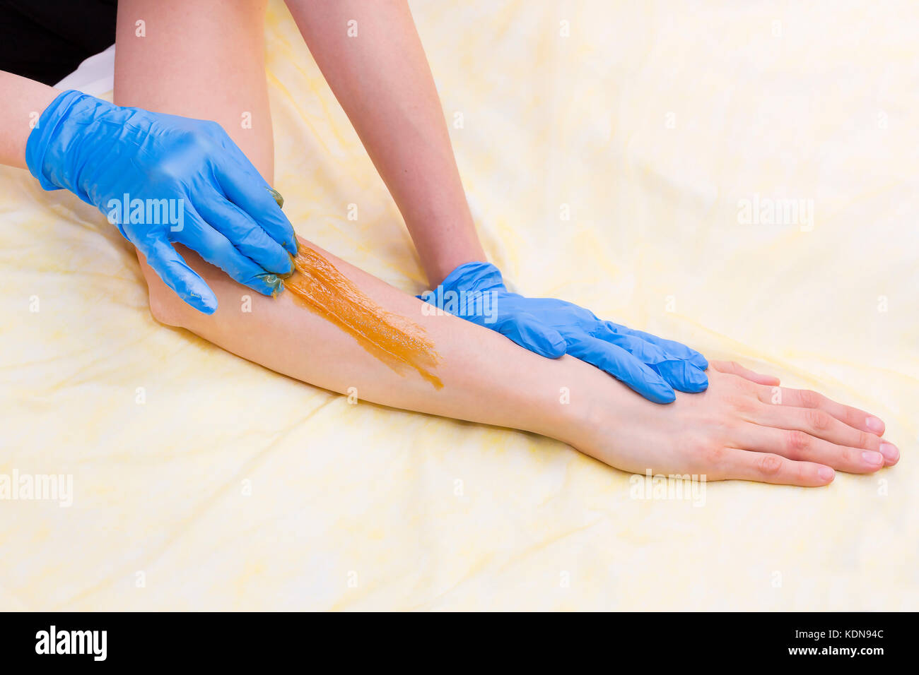 Epilation sugar processes woman passes hi-res stock photography and ...