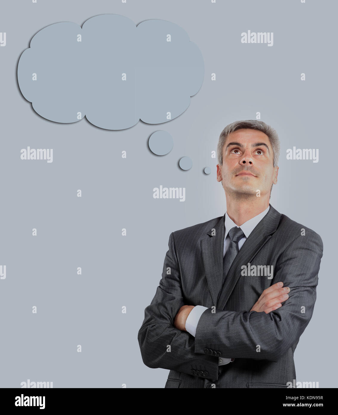 Handsome smiling young man looking up over white background Stock Photo ...
