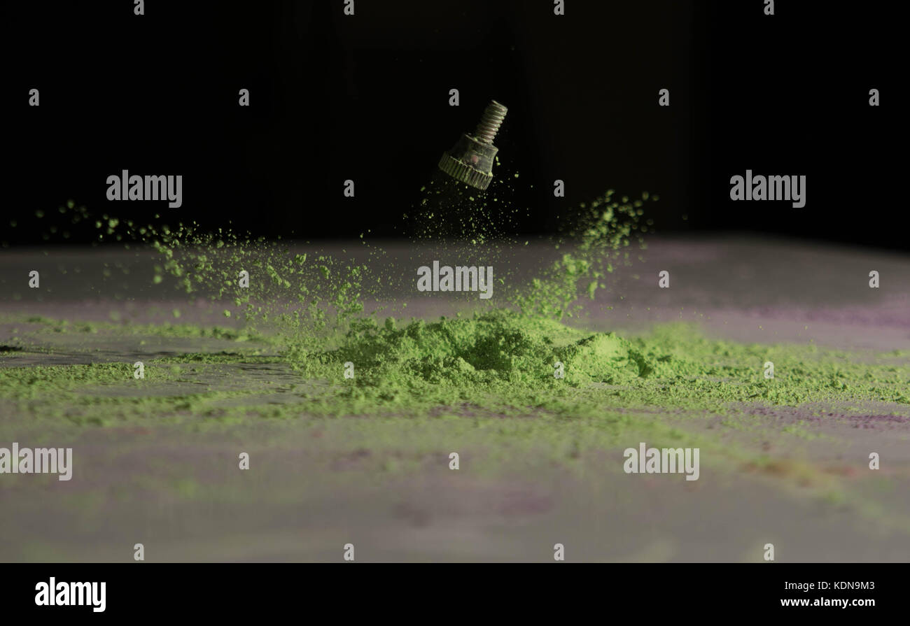 Slow motion ball hitting powder Stock Photo - Alamy