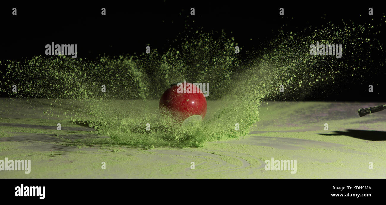 Slow motion ball hitting powder Stock Photo - Alamy
