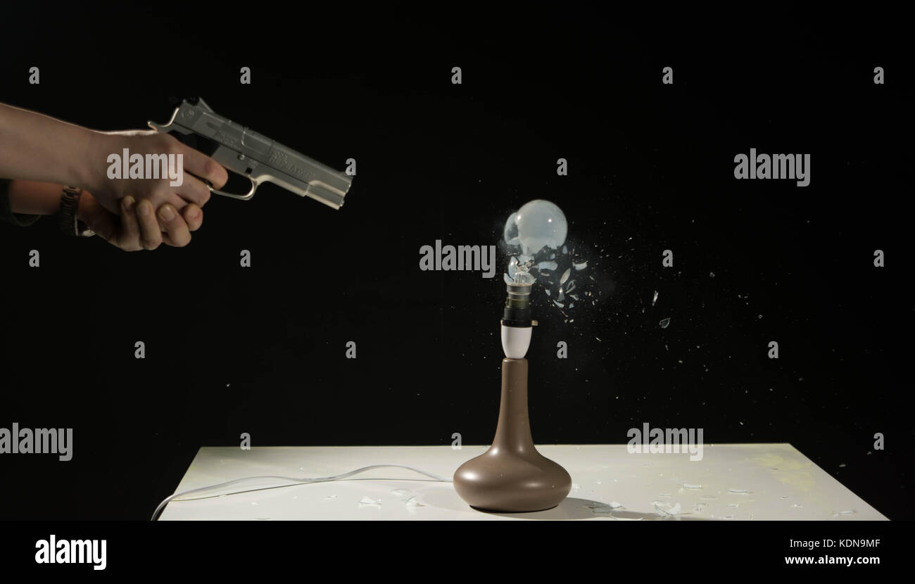 Pellet hitting Exploding lightbulb Stock Photo - Alamy