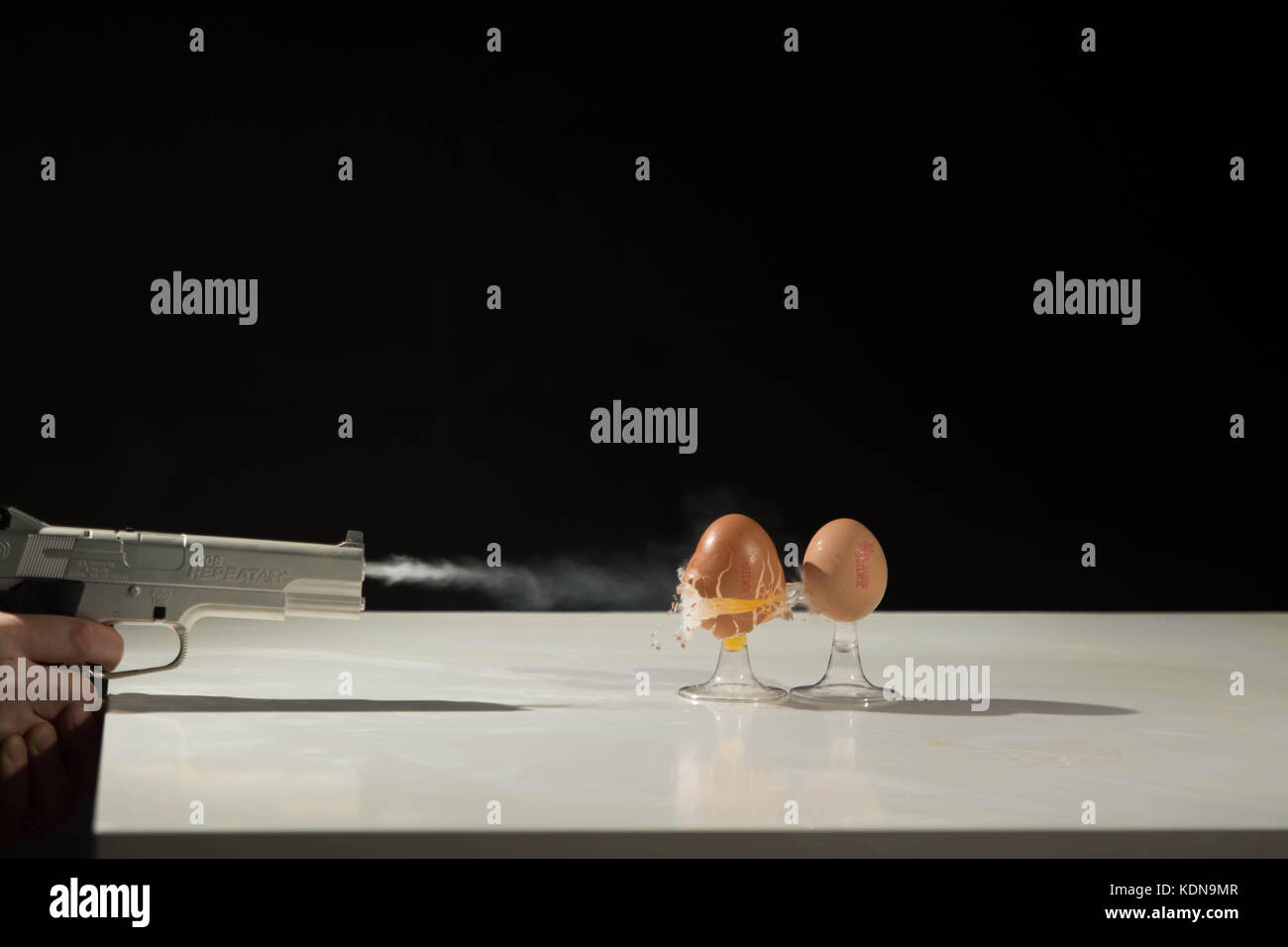 Gun pellet hitting raw egg Stock Photo - Alamy