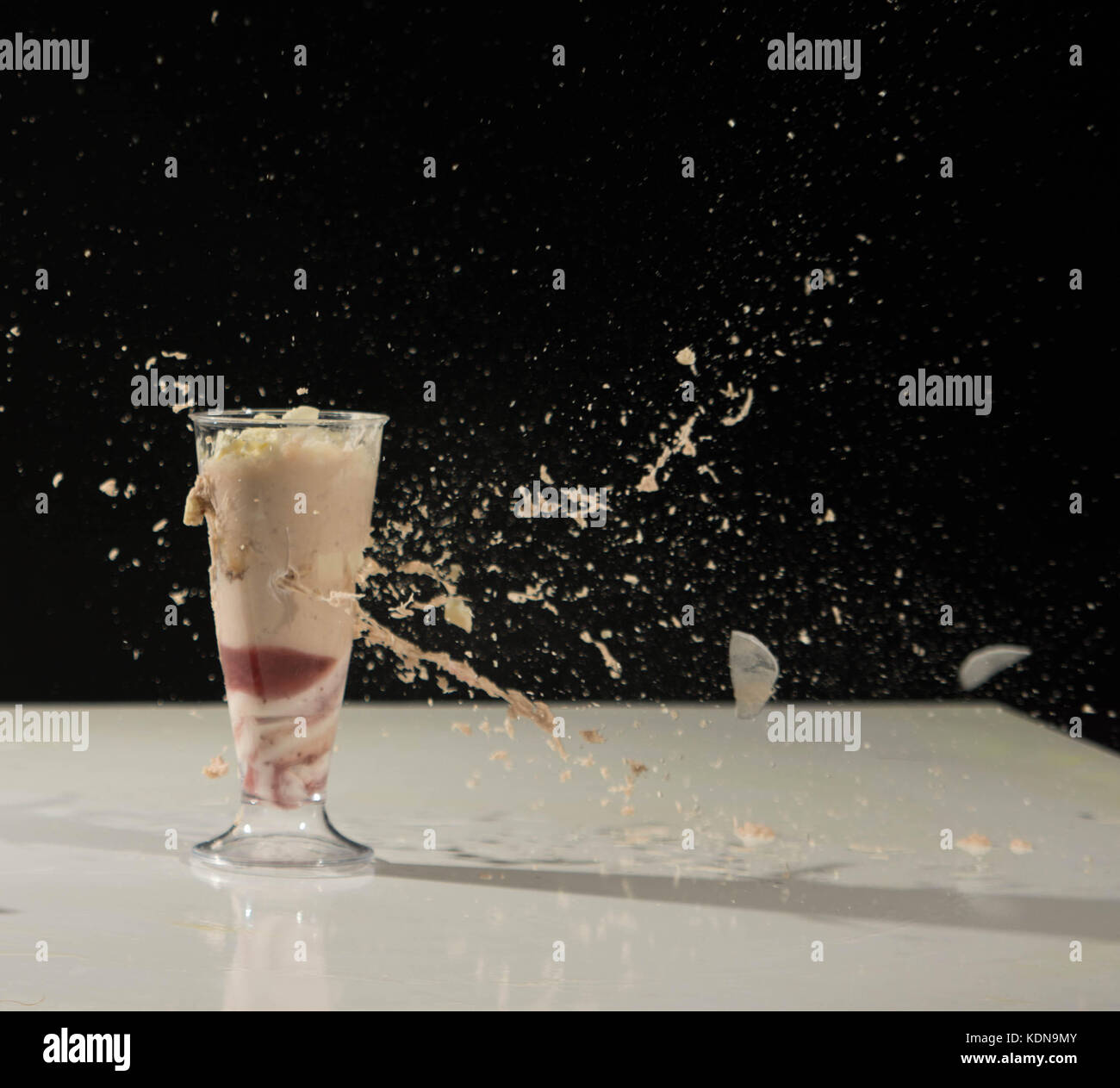 Pellet bursting through ice cream Stock Photo - Alamy