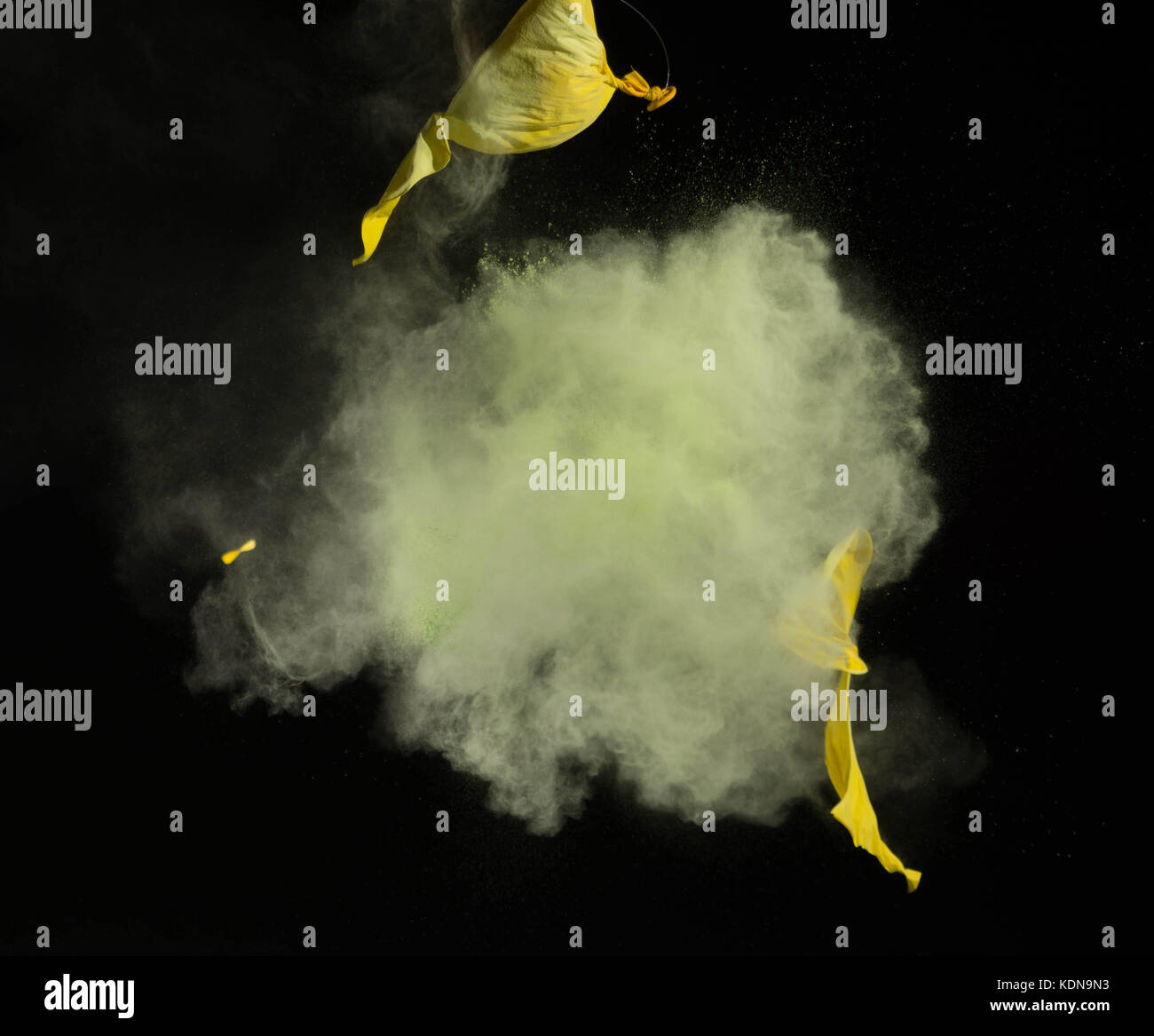 Bursting balloon full of powder Stock Photo - Alamy
