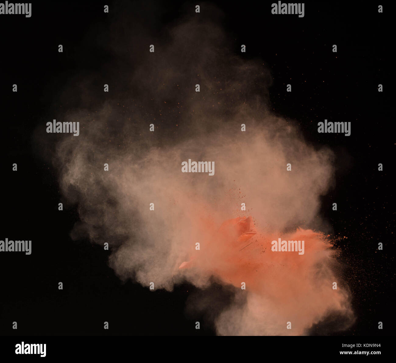 Exploding cloud of red powder Stock Photo - Alamy