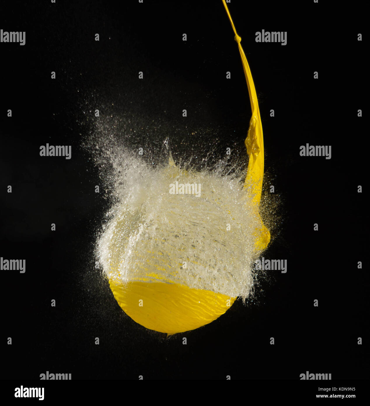 Water filled balloon bursting Stock Photo - Alamy