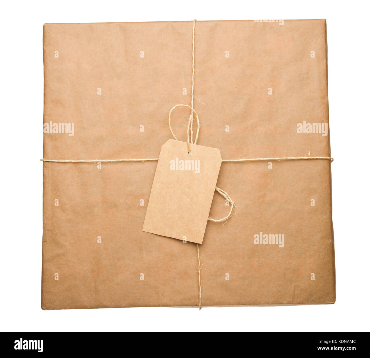 Parcel wrapped in brown paper and tied with rough twine Stock Photo - Alamy