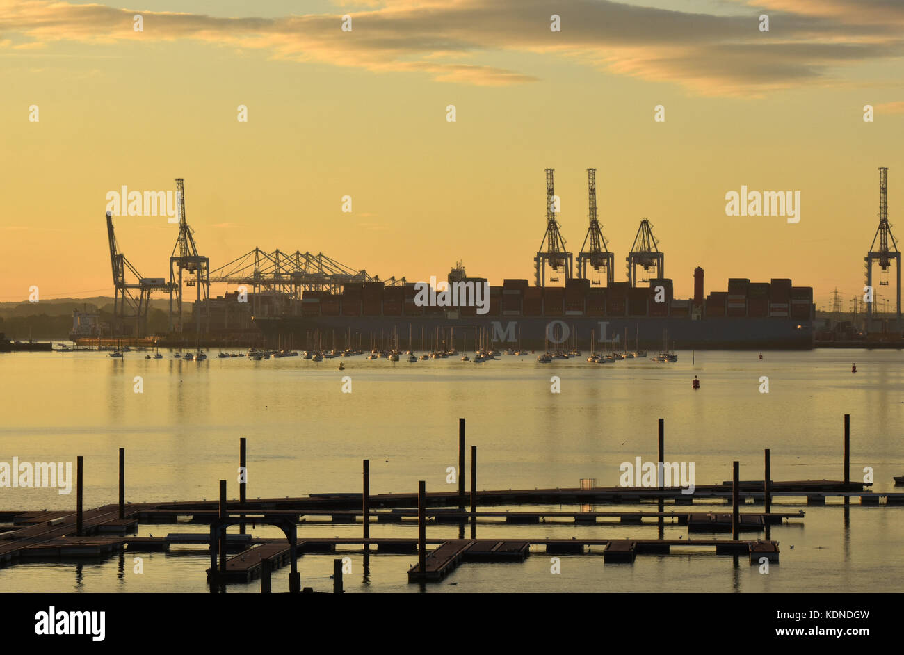 Silhouettes container cranes at port hi-res stock photography and ...