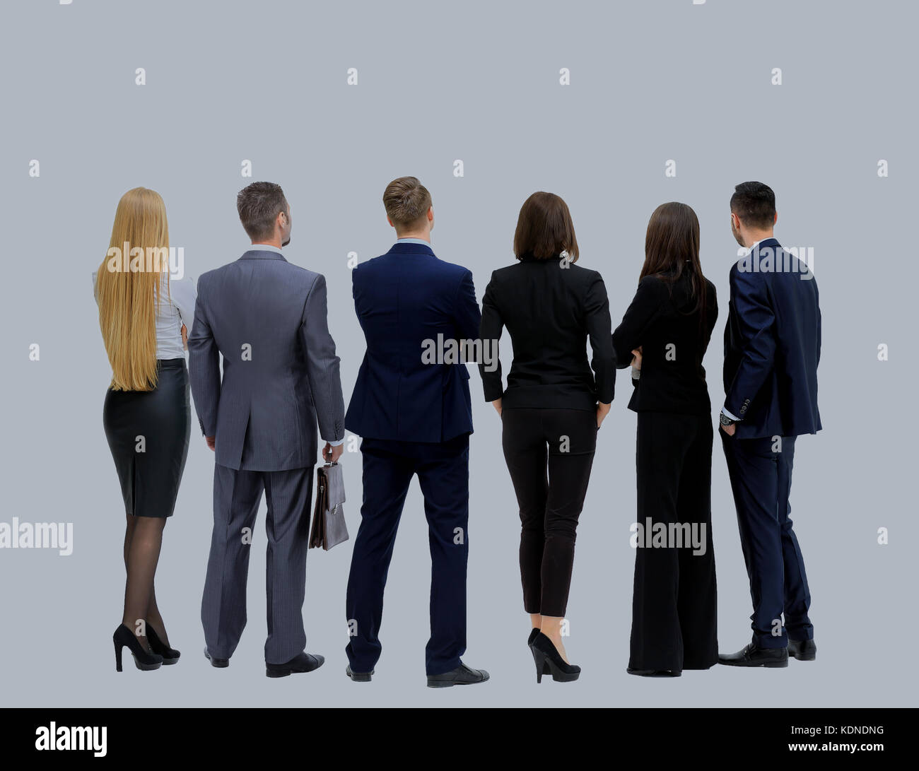 Successful business team looking upwards standing back side Stock Photo ...