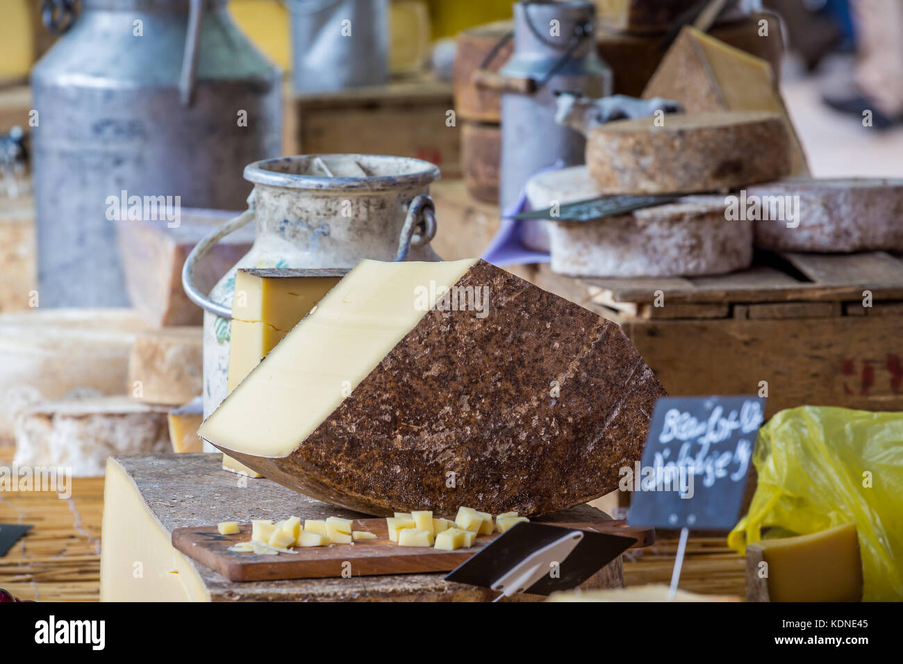 Cheeses for sale on market stall Stock Photo - Alamy