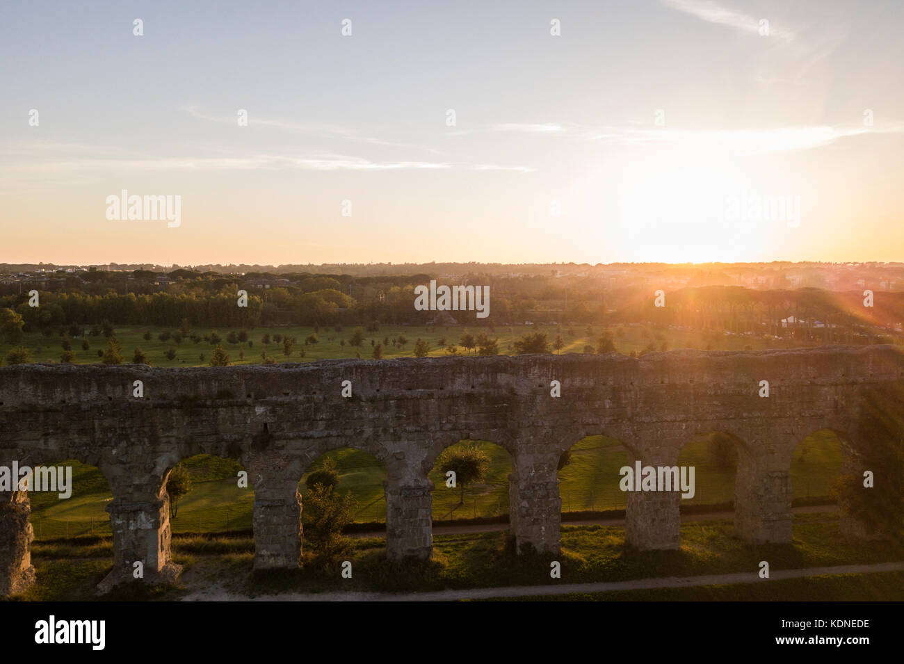 Aerial view of the ancient aqueduct of the Roman empire at sunset. The ...