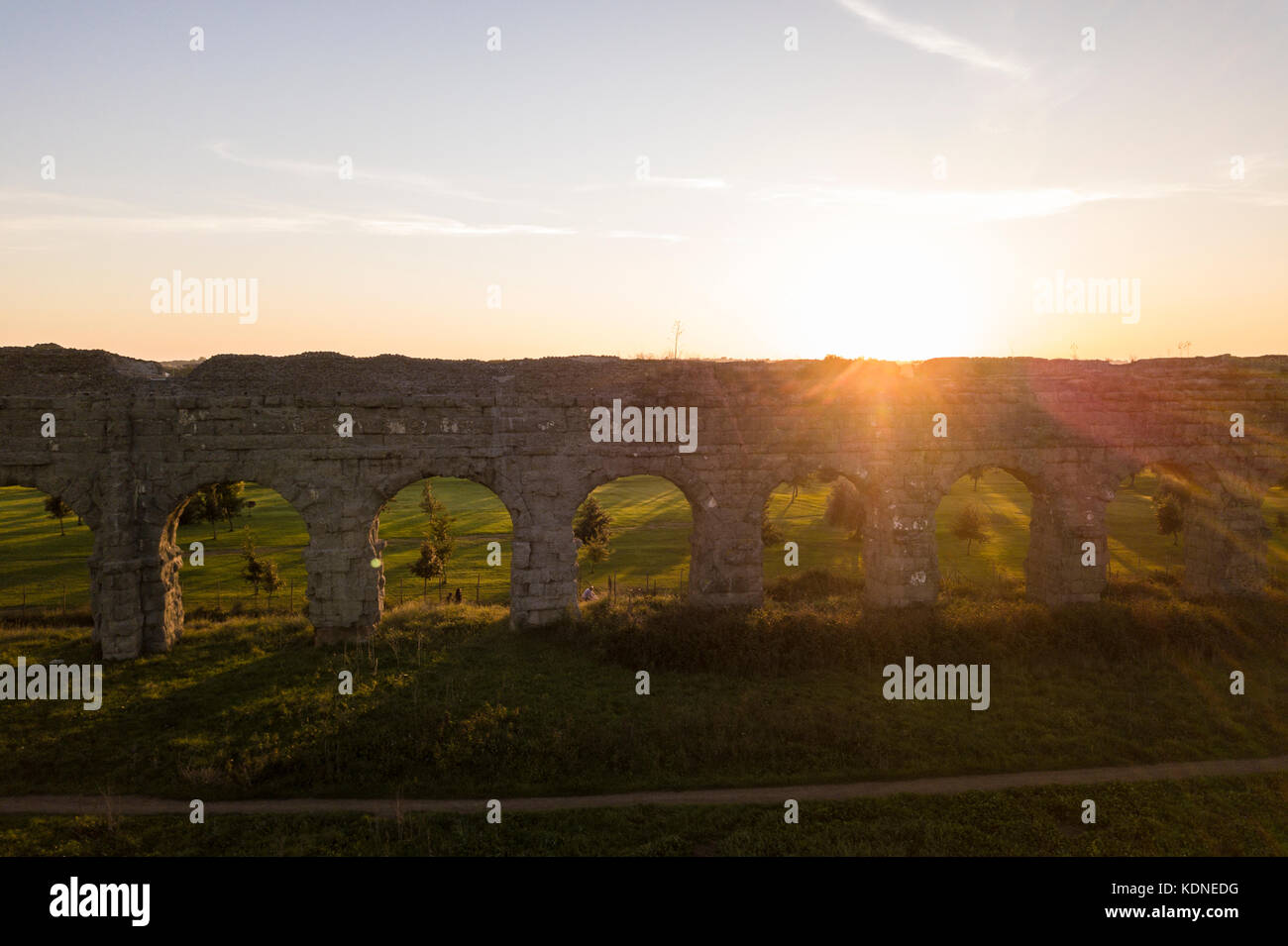 Aerial view of the ancient aqueduct of the Roman empire at sunset. The ...