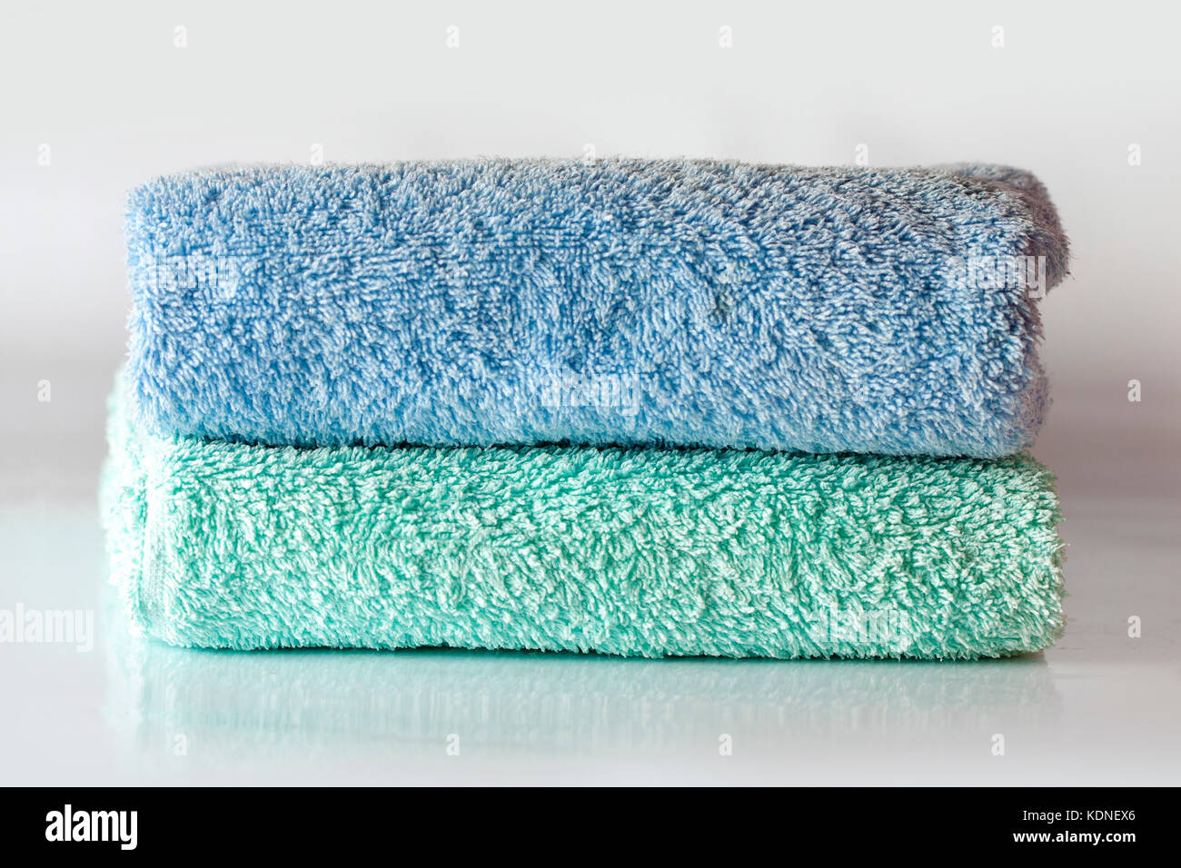 Blue and turquoise towels on the white background - spa & wellness ...