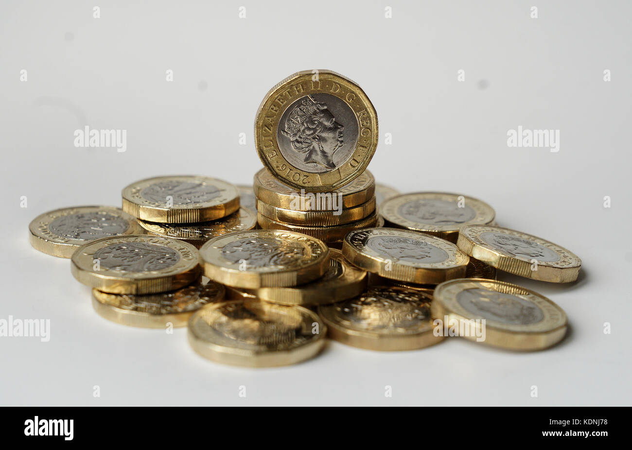 Examples of the new £1 coin as from midnight on Sunday the old round ...