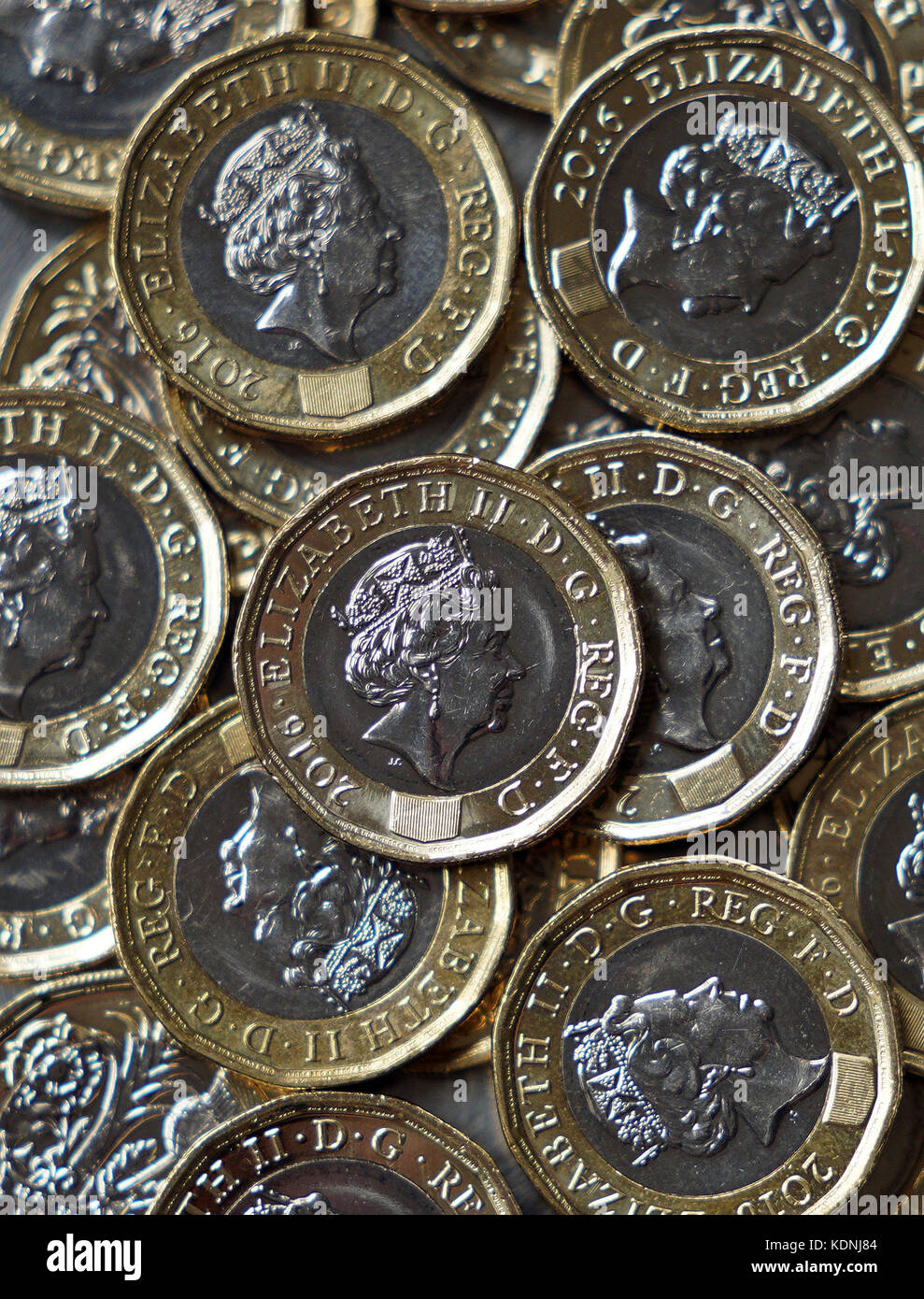 Examples of the new £1 coin as from midnight on Sunday the old round ...