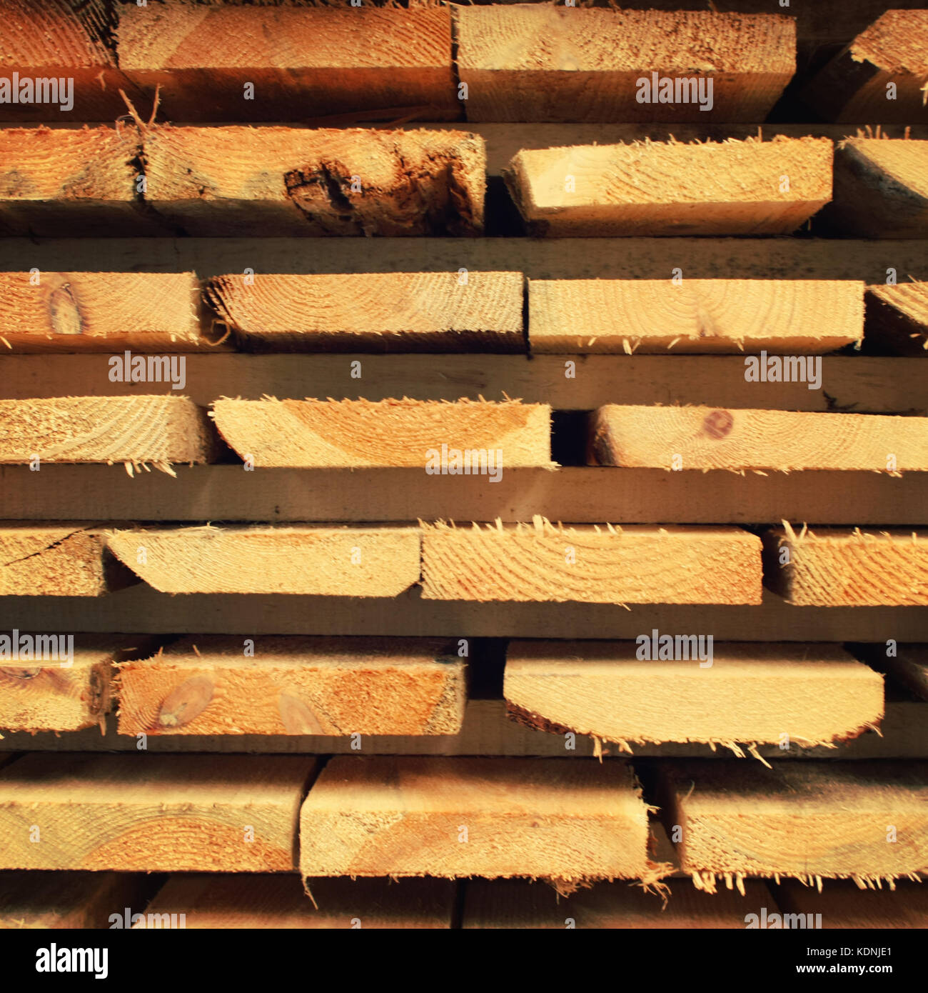 Stack of wooden bars. Aged photo. Wood timber construction material ...