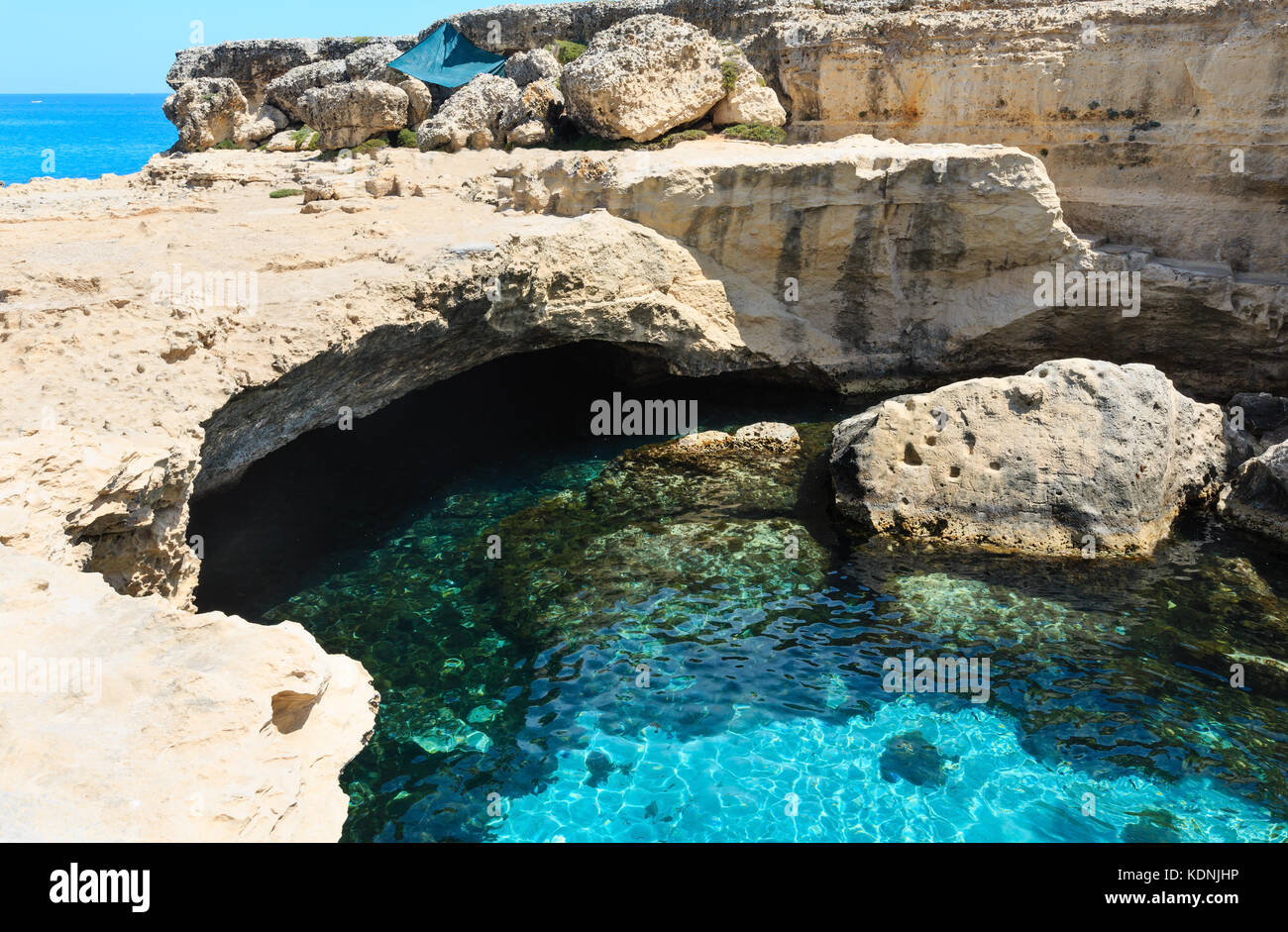 Picturesque seascape with white rocky cliffs, caves, sea bay and islets ...